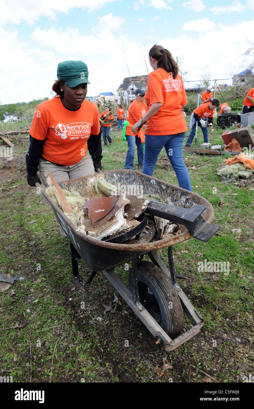 SAINT LOUIS, MISSOURI - APRIL 26: A woman clean up after tornadoes hit ...