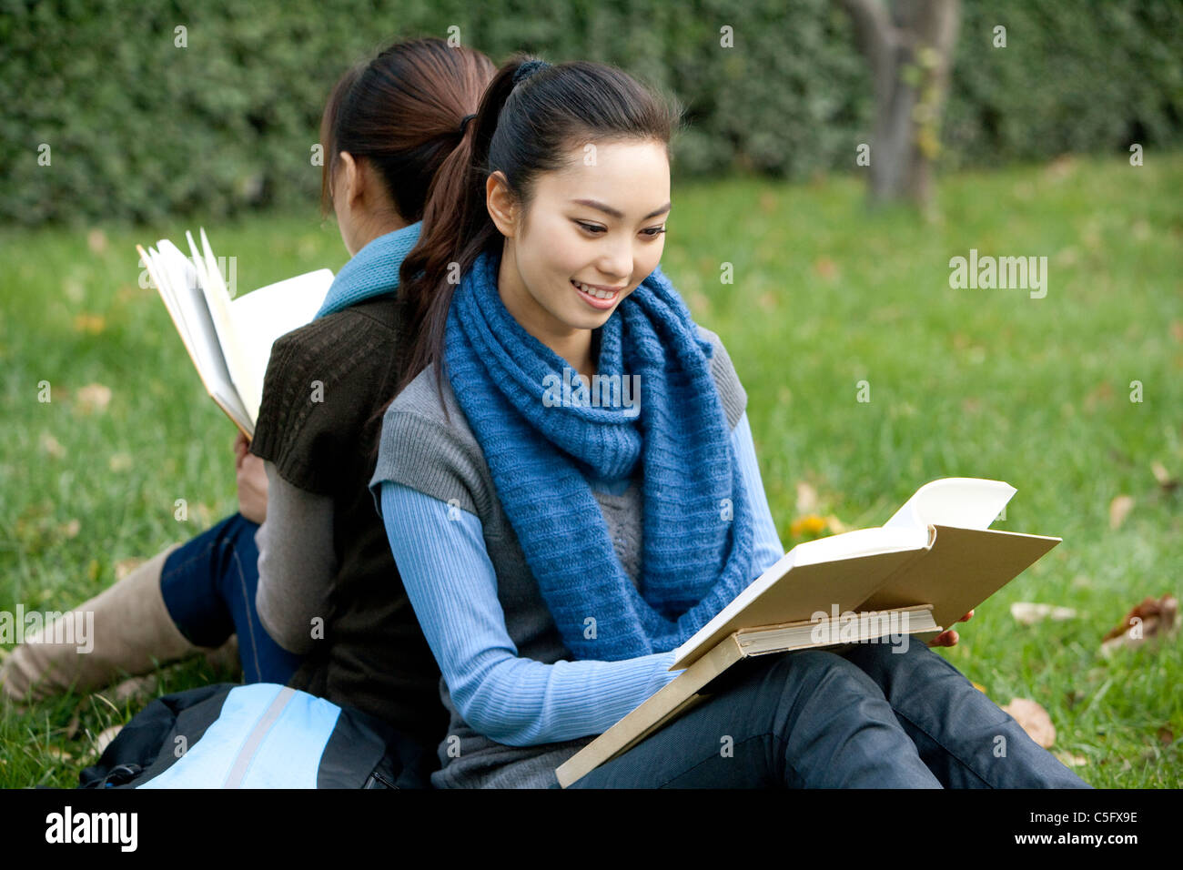 Two Reading Friends Sitting Back High Resolution Stock Photography and ...
