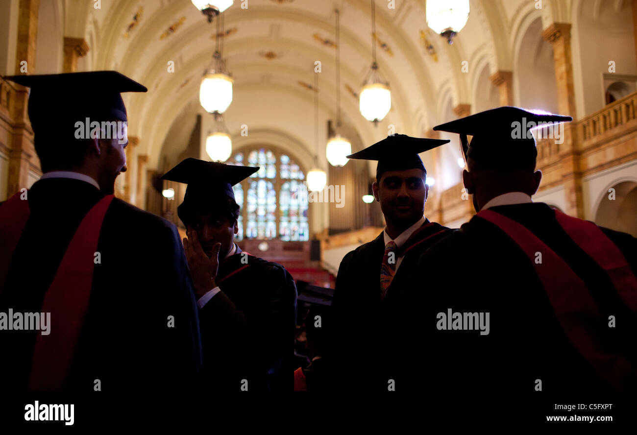 Four male graduates await the degree ceremony in the Great Hall of ...
