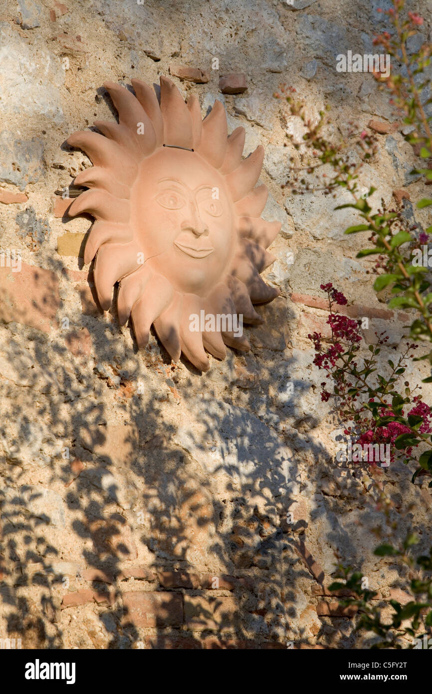 Terracotta sun design motif Rosia , Tuscany , Italy Stock Photo - Alamy