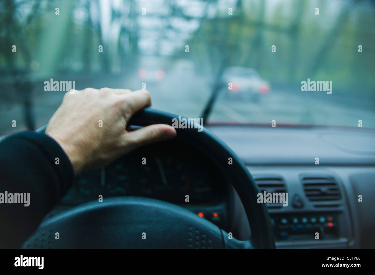 A first person perspective of driving a car on a highway over a bridge ...