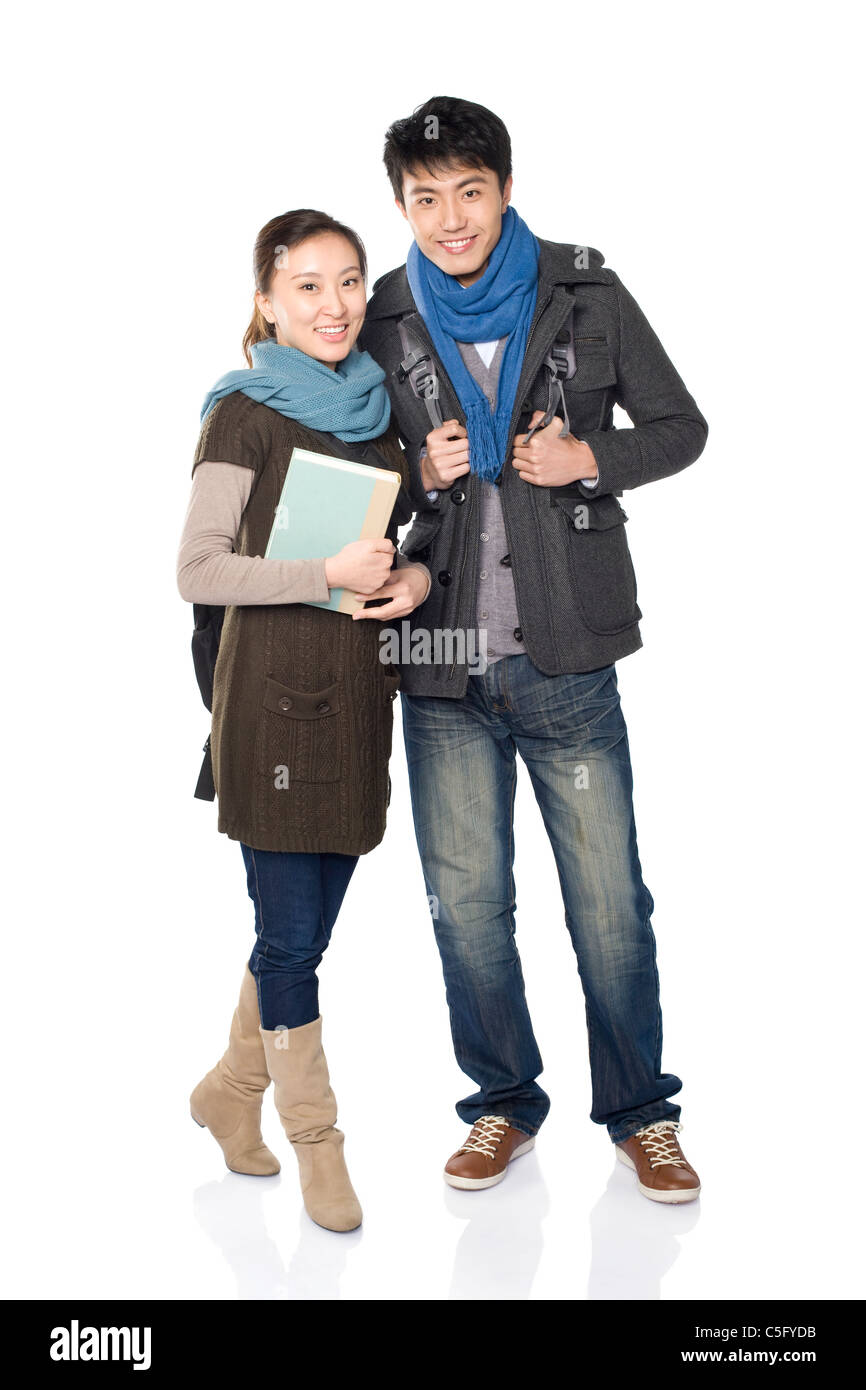 Two classmates smiling, white background Stock Photo - Alamy