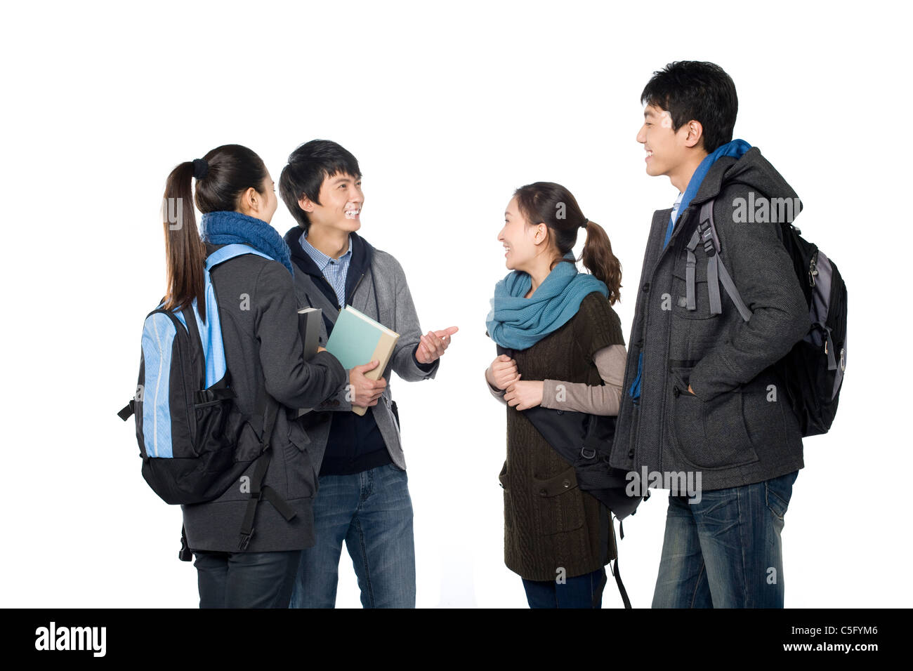 Four classmates talking, white background Stock Photo - Alamy