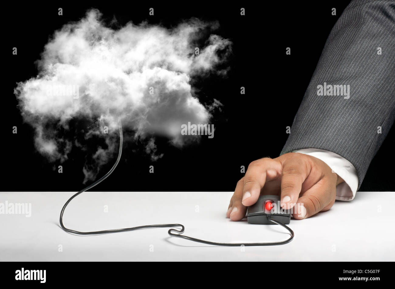 A hand grabbing a mouse connected to a cloud Stock Photo - Alamy