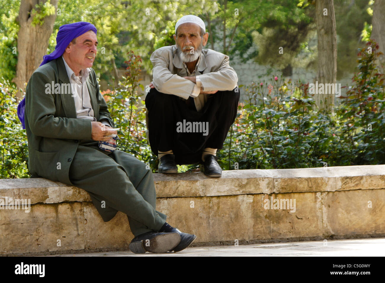 Two Turkish men sitting in park, Sanliurfa (Urfa), Turkey Stock Photo ...