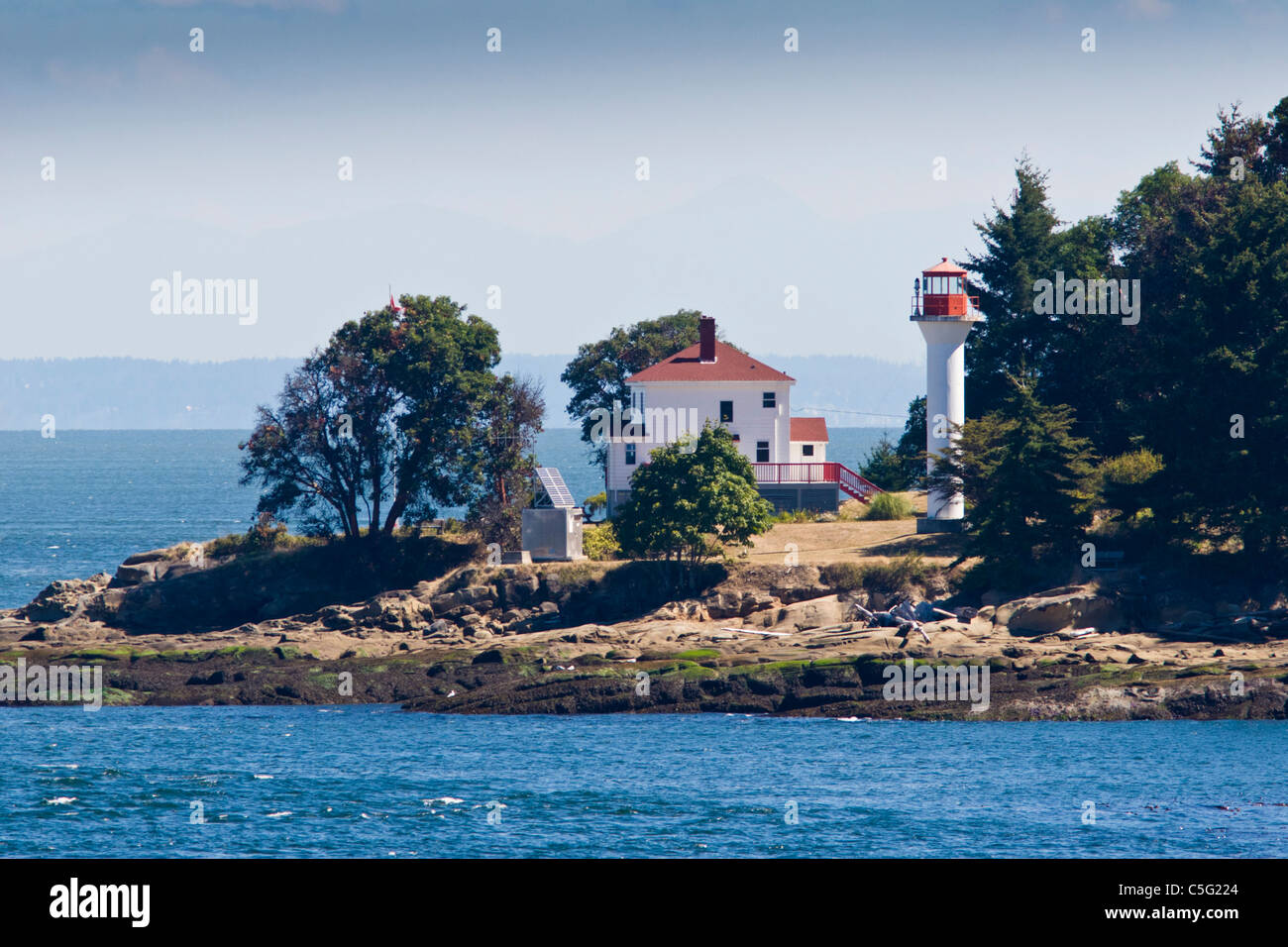 Active Pass Lighthouse on Mayne Island in the Gulf Islands between ...