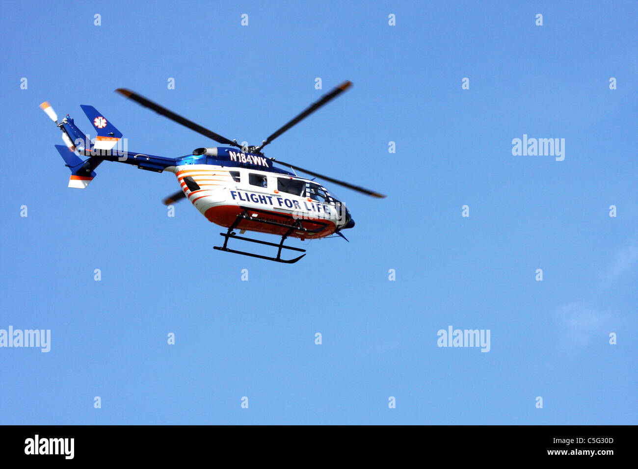 A Flight for Life helicopter flying in the sky Stock Photo - Alamy