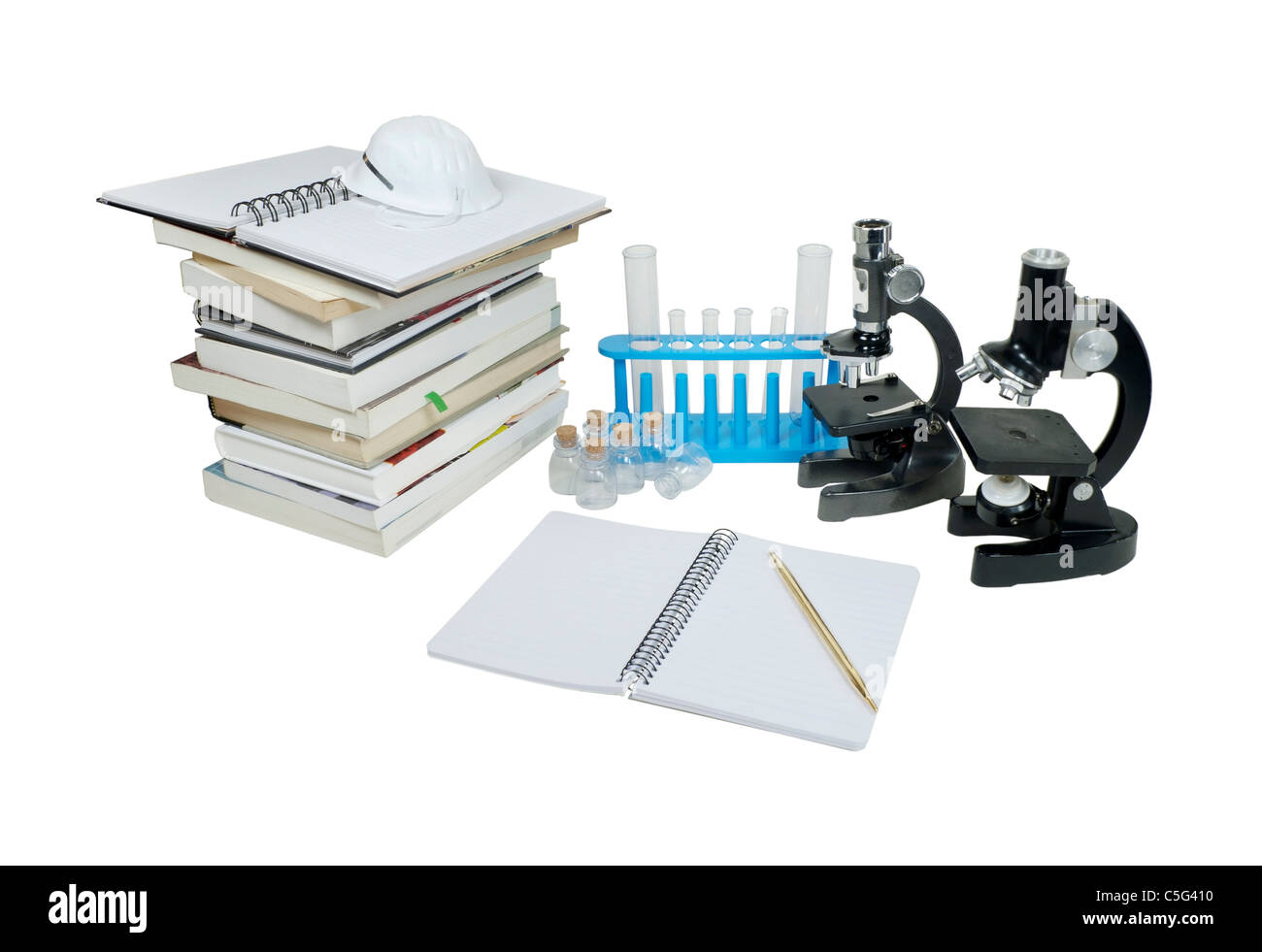 Laboratory research shown by microscopes and test tubes with a stack of ...