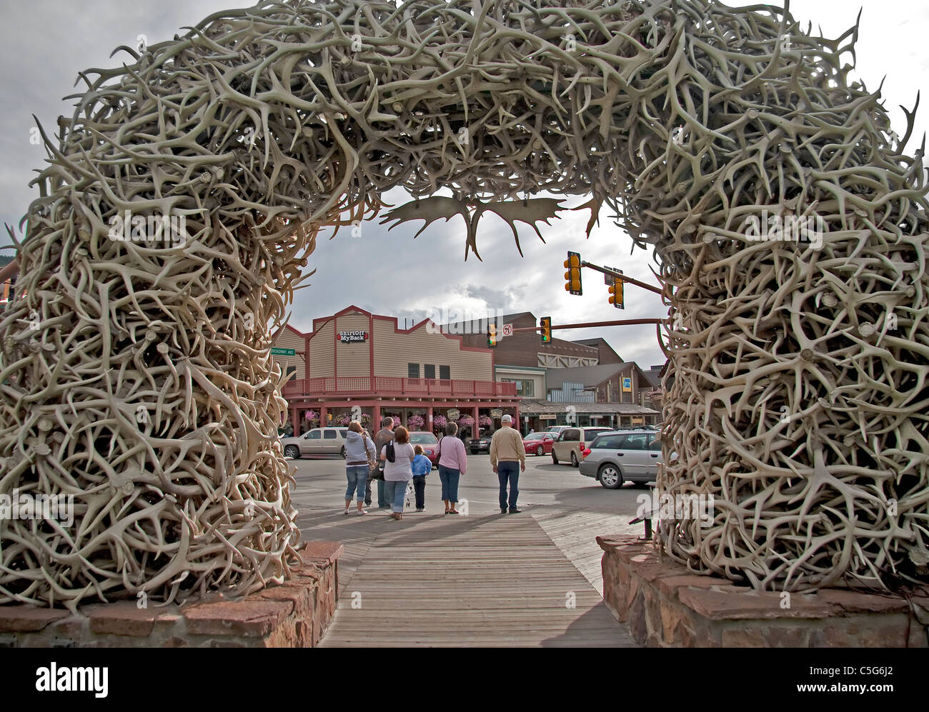 A young child exploring Jackson Hole's unusual Antler Gate Stock Photo ...