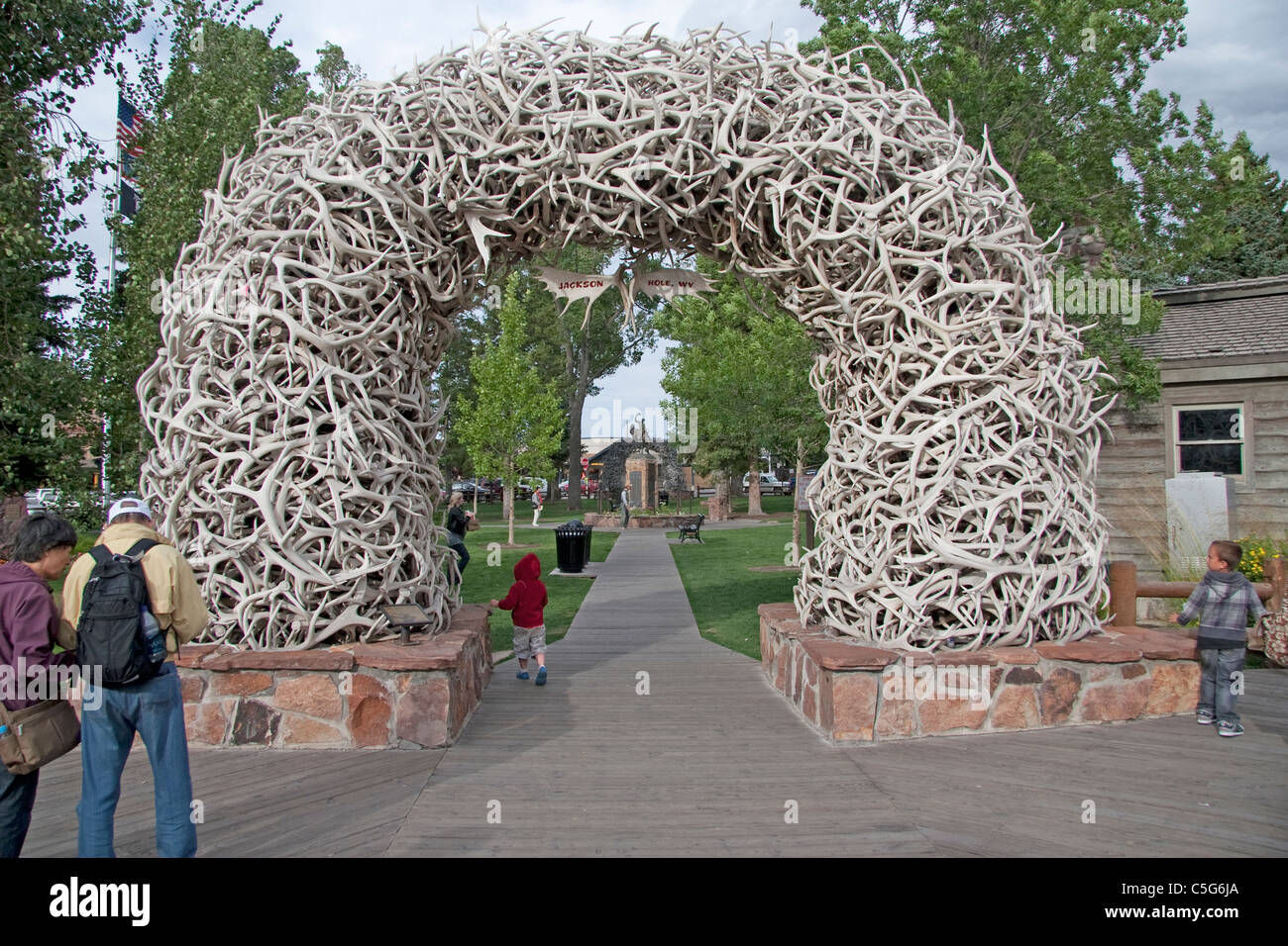 A young child exploring Jackson Hole's unusual Antler Gate Stock Photo ...