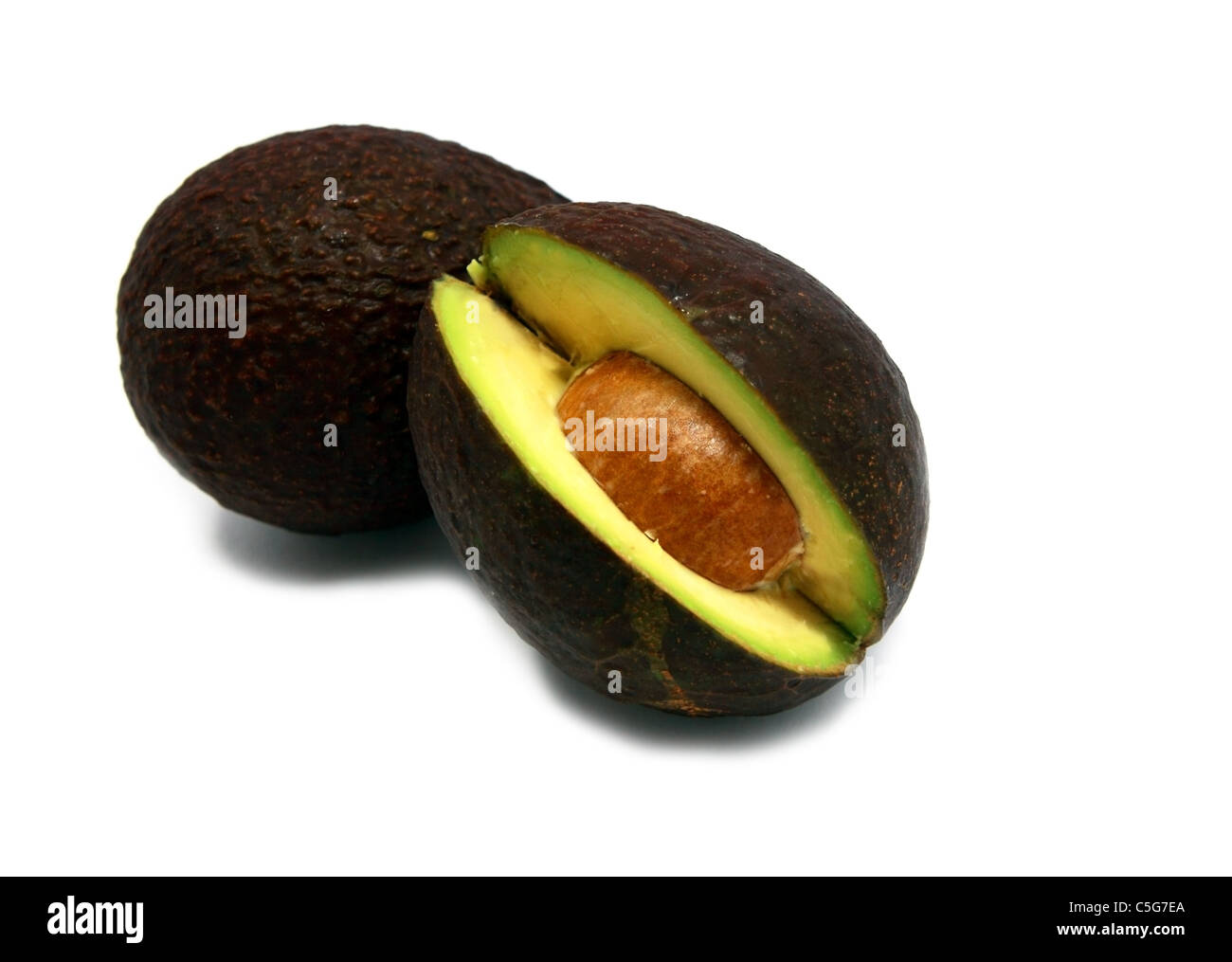 two fresh avocados isolated on white background Stock Photo - Alamy