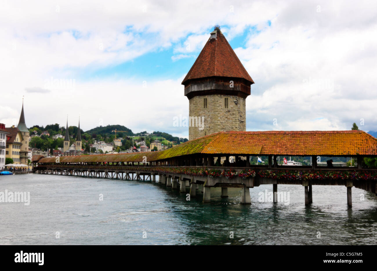 The Chapel Bridge with the historical Water Tower in Lucerne ...