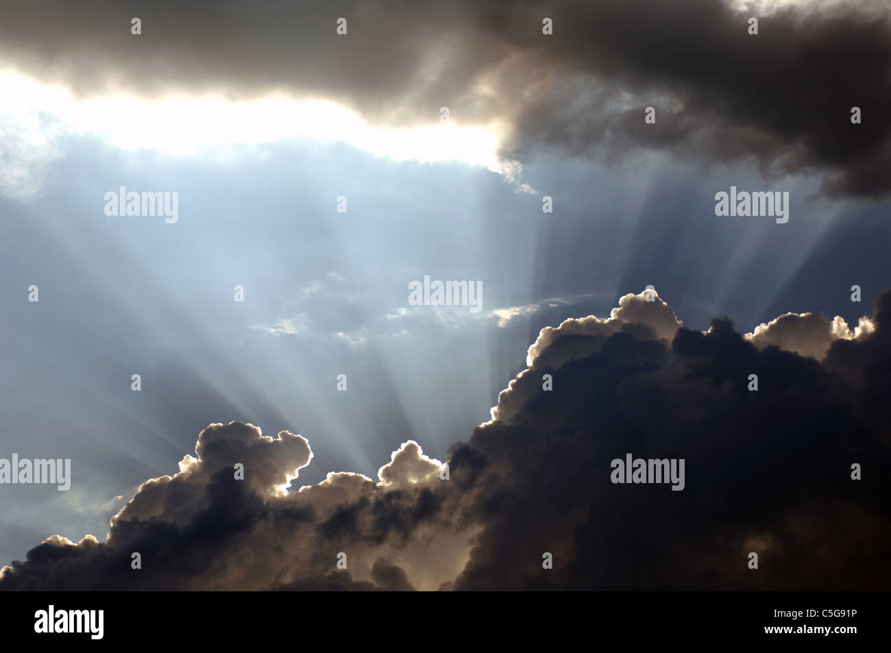 Sunbeams coming through the clouds, Liechenstein Stock Photo - Alamy