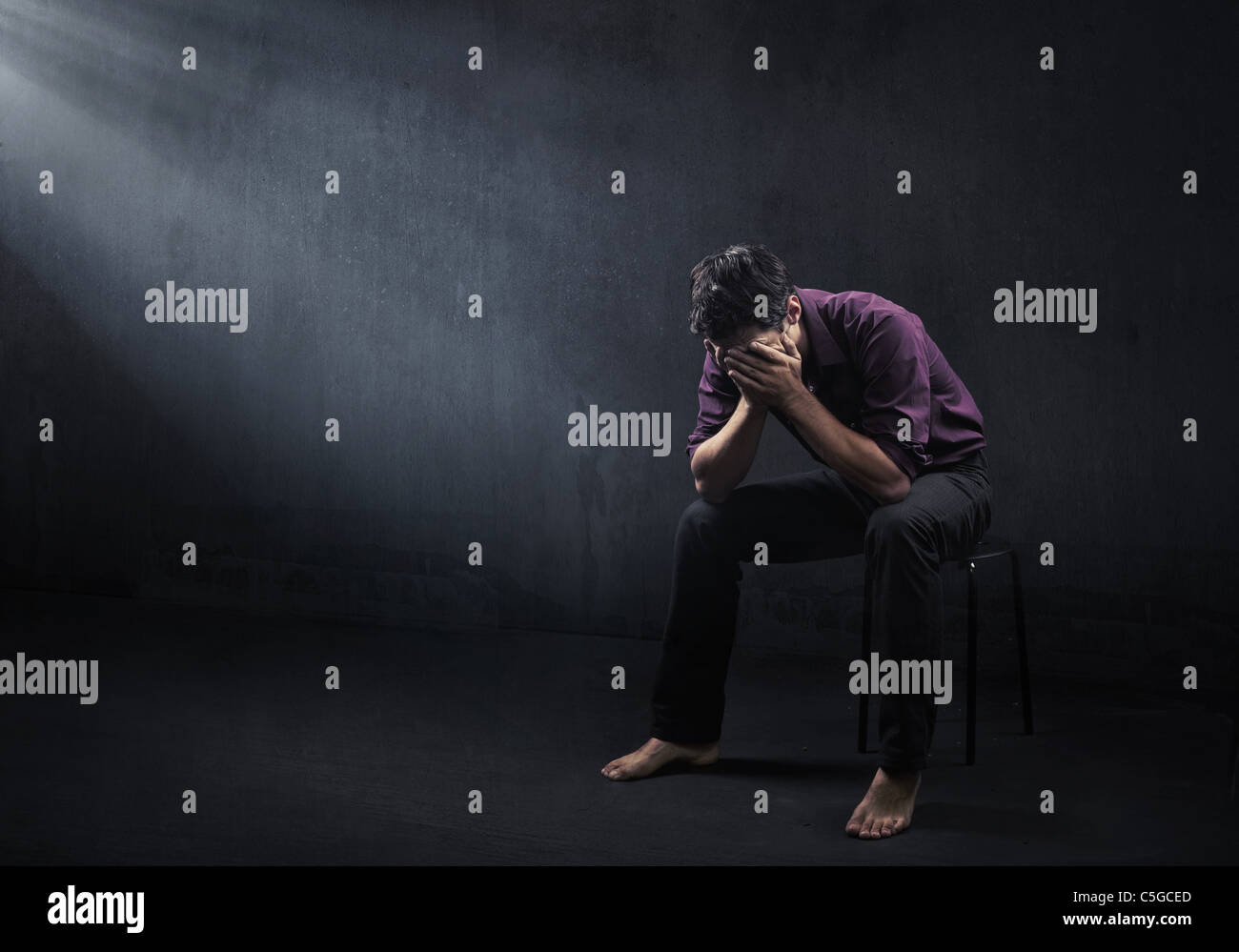 Sad man in a empty room Stock Photo - Alamy