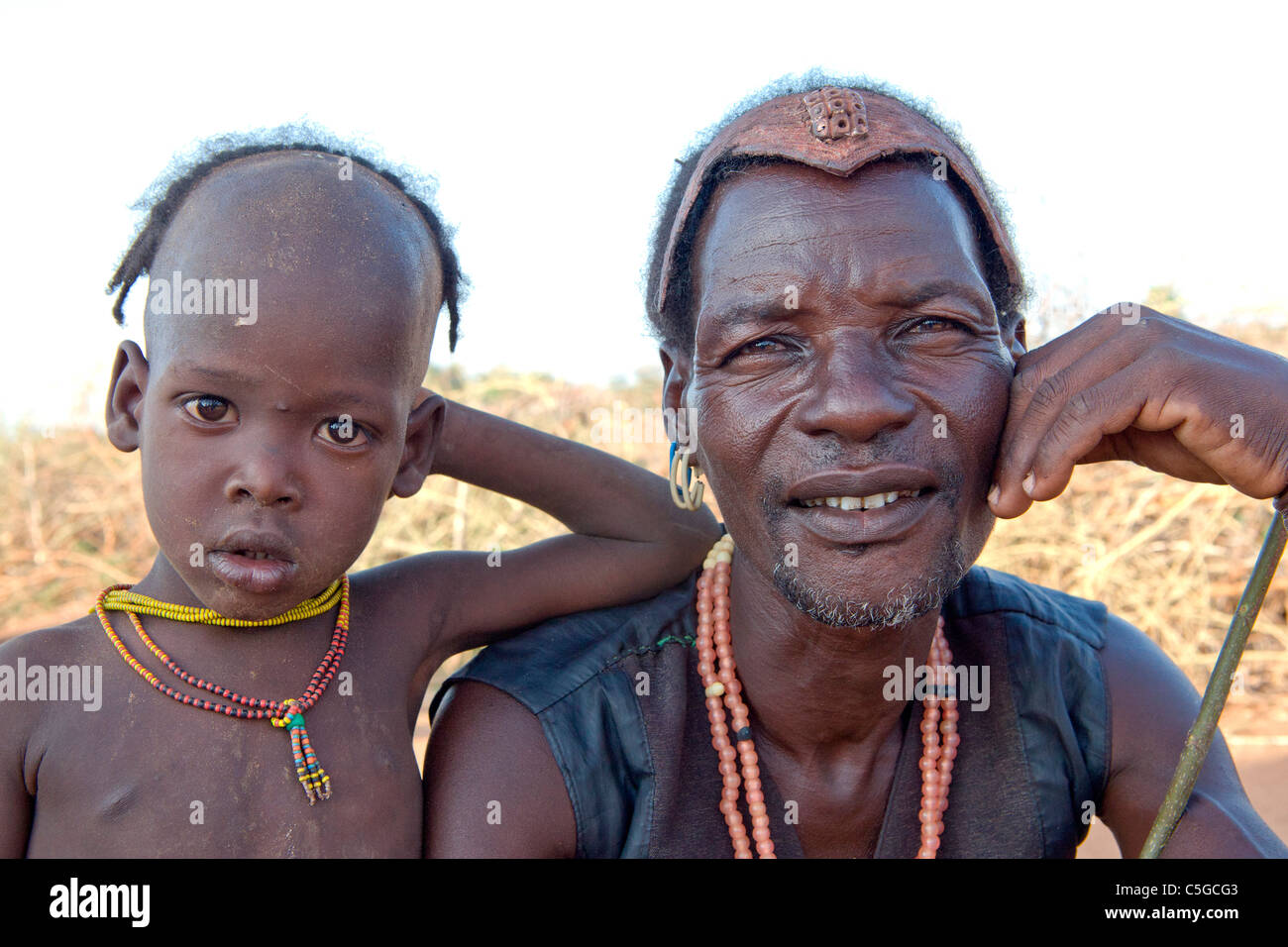 Portrait of a tribesman and child at a village near Turmi in the Lower ...