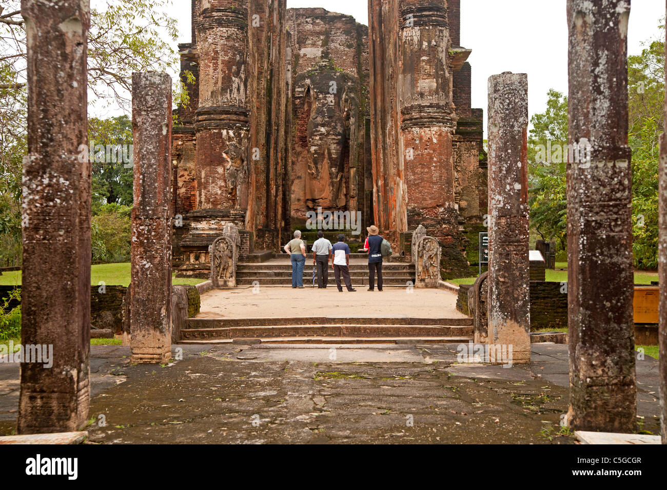 visitors at the ruins of the giant Lankatilaka Temple, Polonnaruwa ...