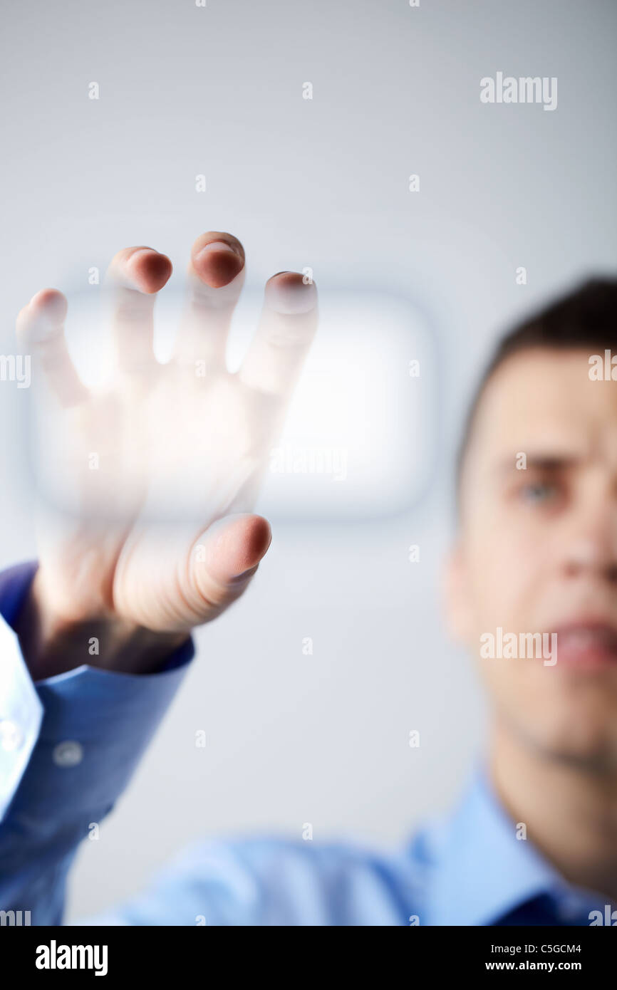 Close-up of businessman hand holding virtual button Stock Photo - Alamy
