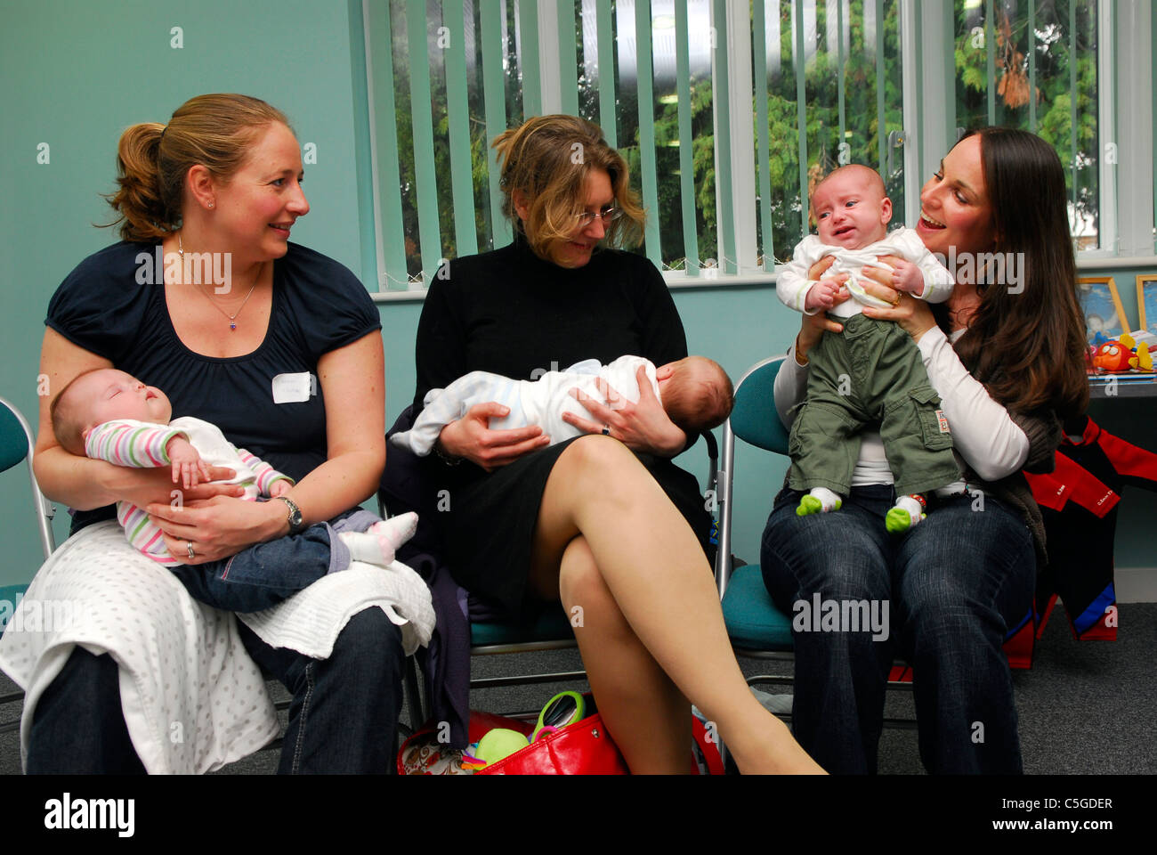 Mother's with their babies in creche, Surrey, UK Stock Photo - Alamy