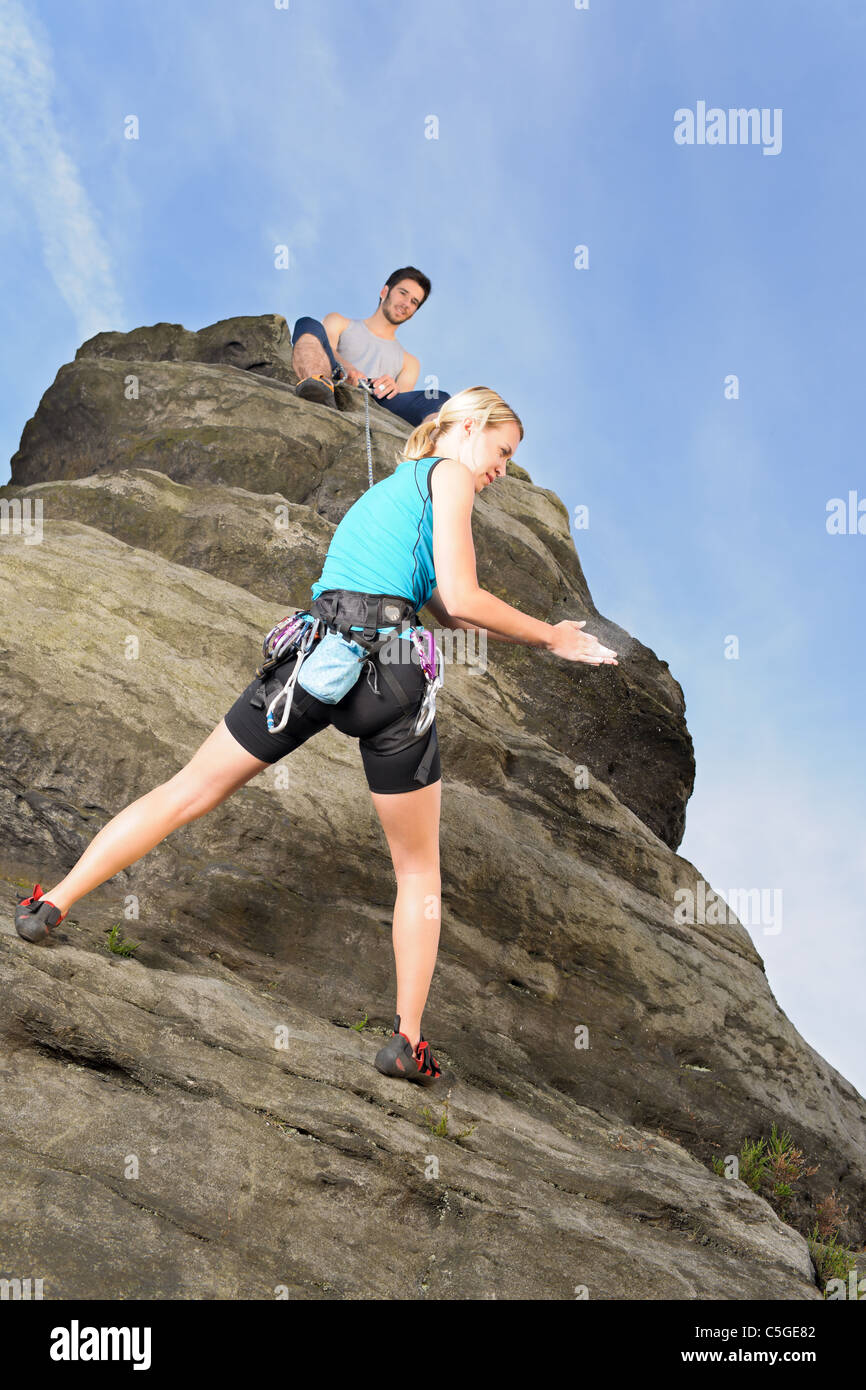 Rock climbing active young woman man holding rope on top Stock Photo ...