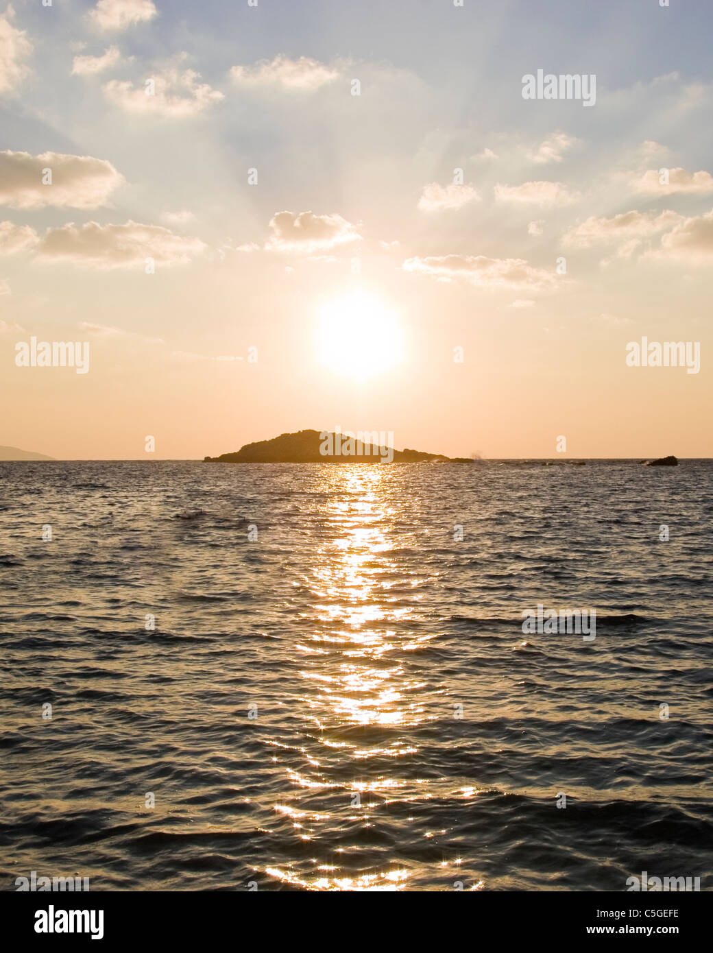 Bright sun rays over a greek island and rough seas Stock Photo - Alamy