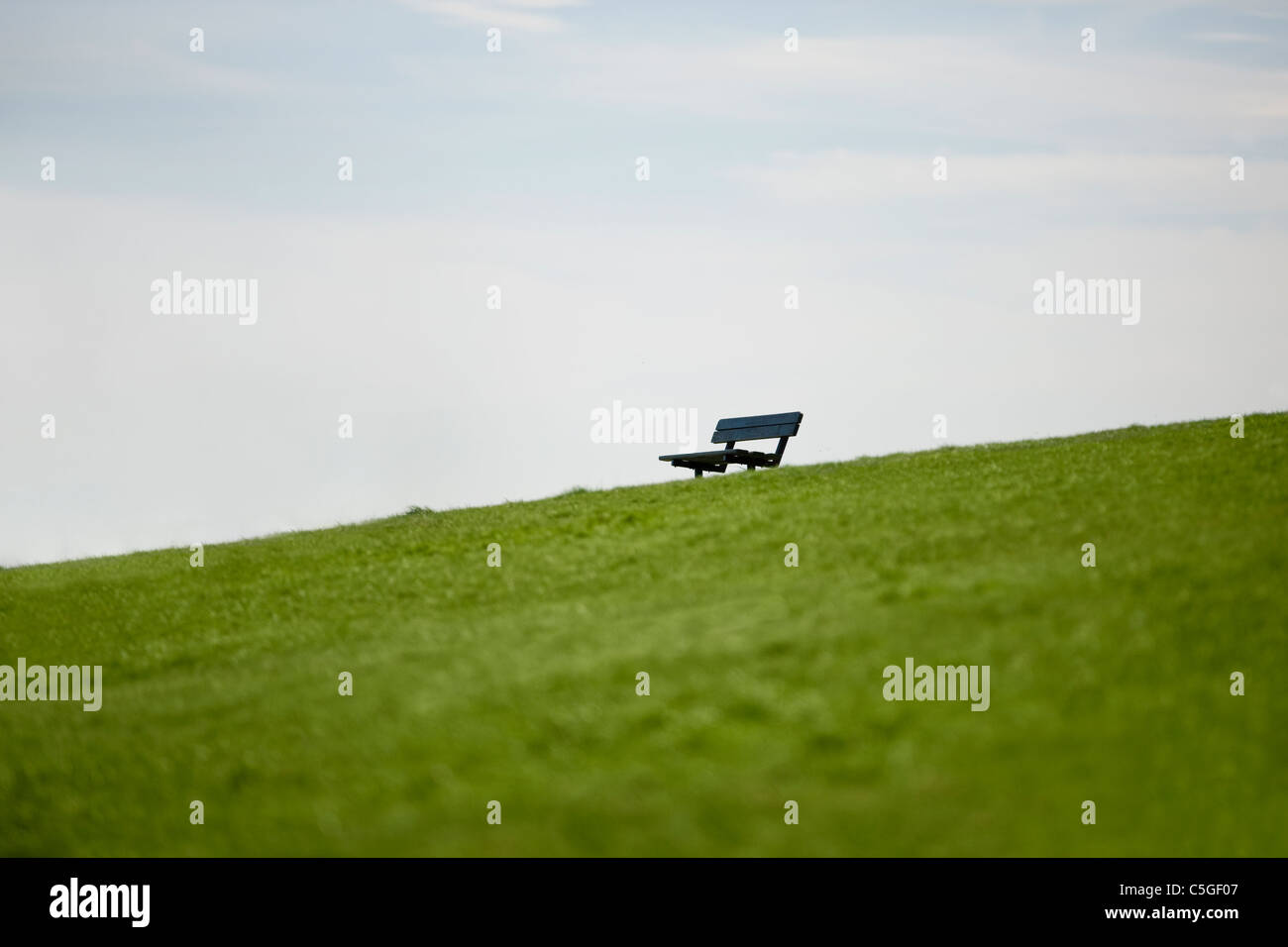 A park bench on a hill Stock Photo - Alamy