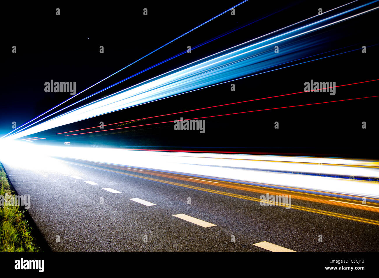 long exposure time photo of car motion blur headlights on road Stock ...