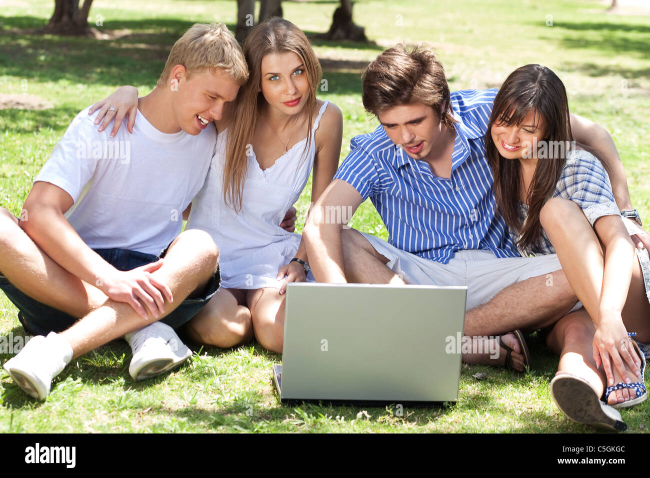 Young boys and girl students using laptop in the campus Stock Photo - Alamy