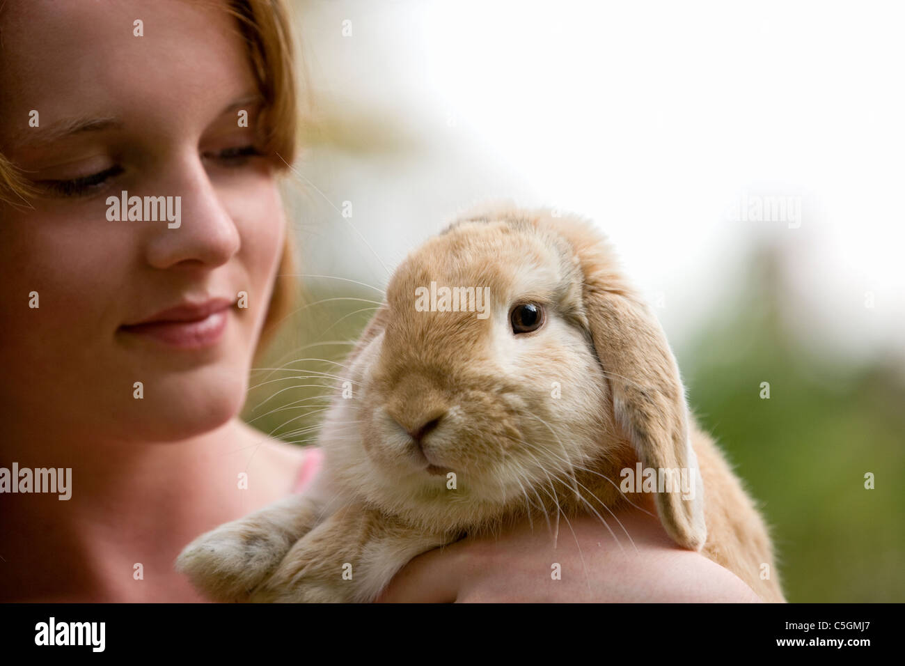 A young girl holding her pet rabbit, close-up Stock Photo - Alamy
