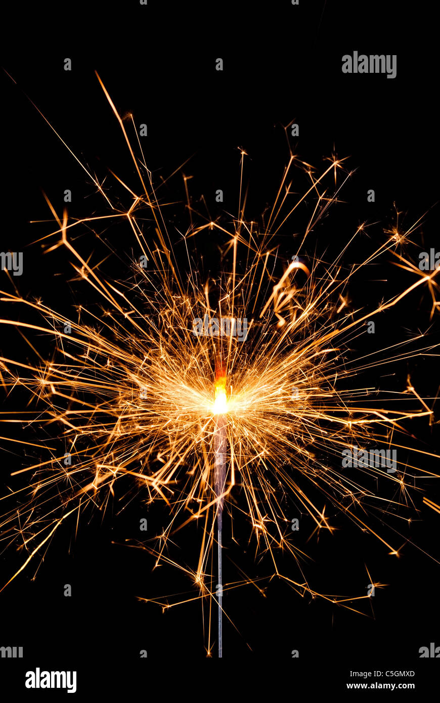 a burning sparkler before black background Stock Photo - Alamy