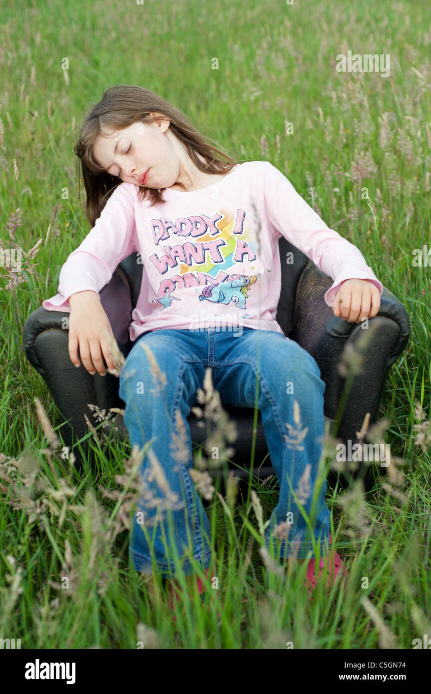 Young girl asleep in old chair Stock Photo - Alamy