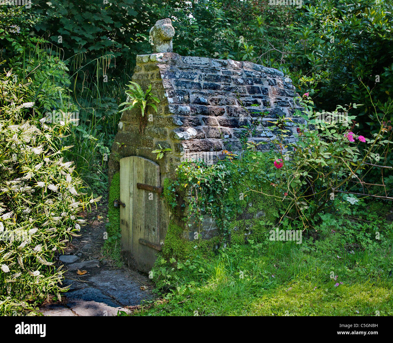 Small stone building housing St John's well Morwenstow on the north ...
