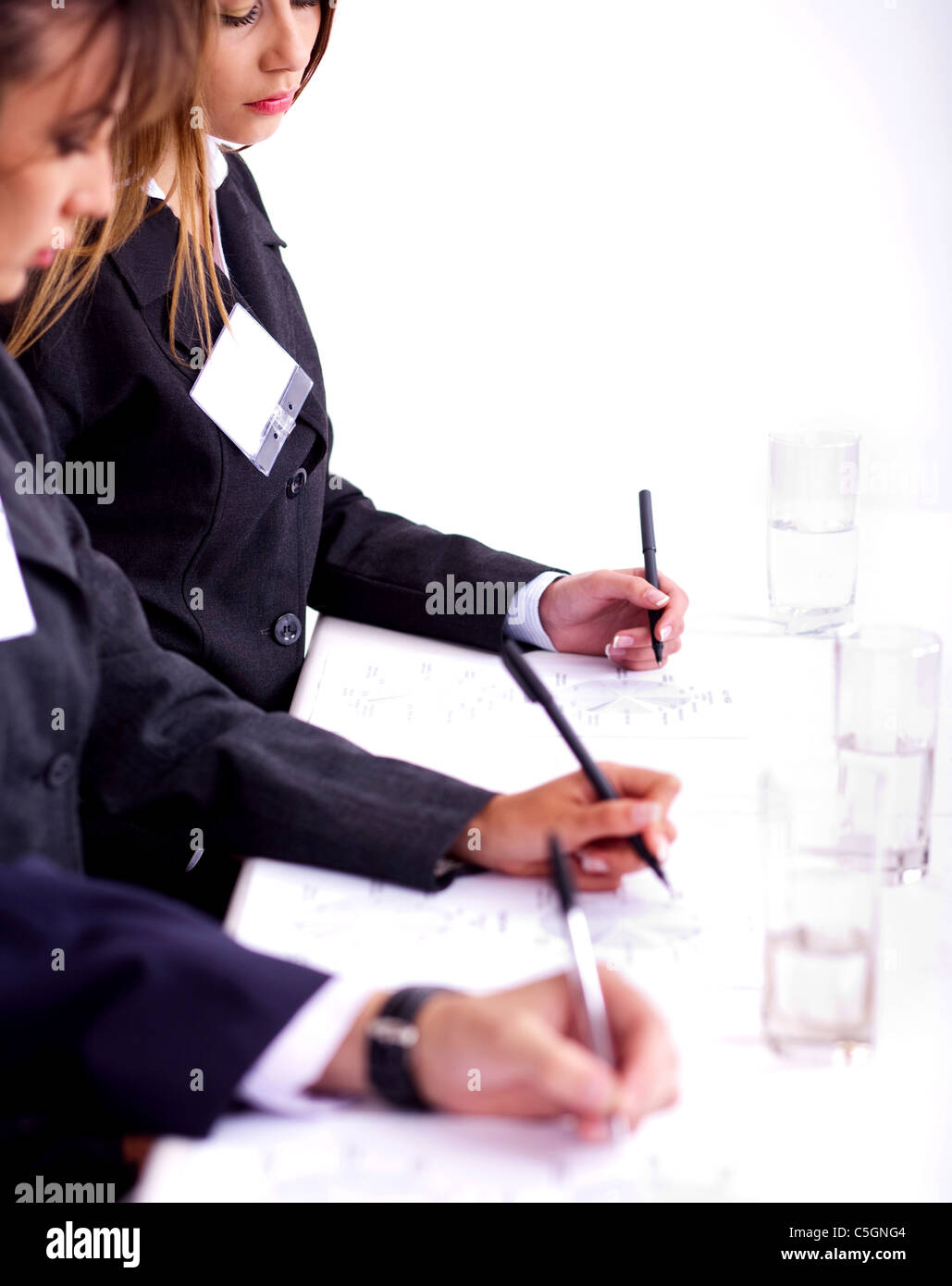 Line of people taking notes at a college lecture, conference or meeting ...