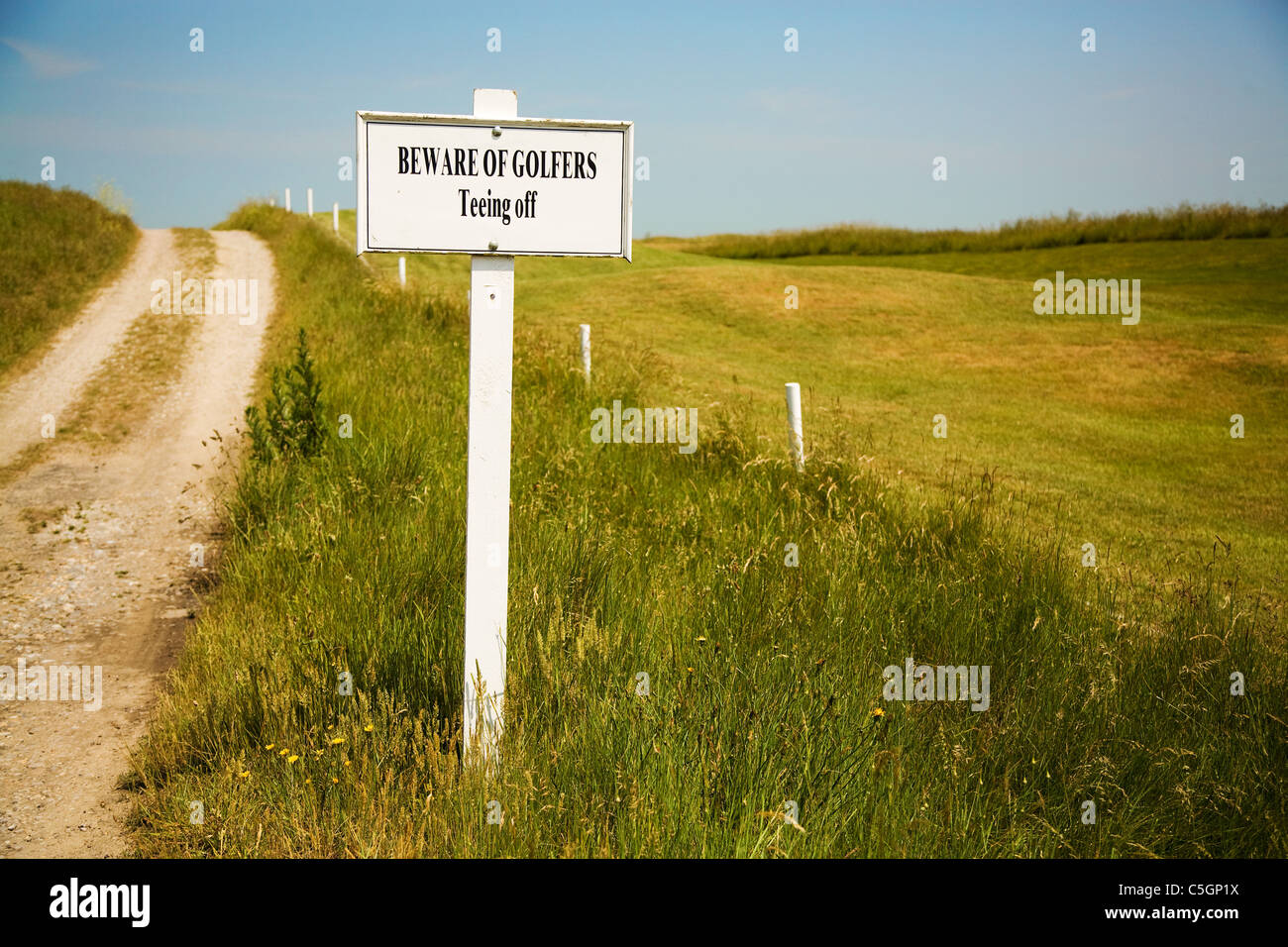 Warning sign beside a track on a Kent golf course ' Beware of Golfers ...