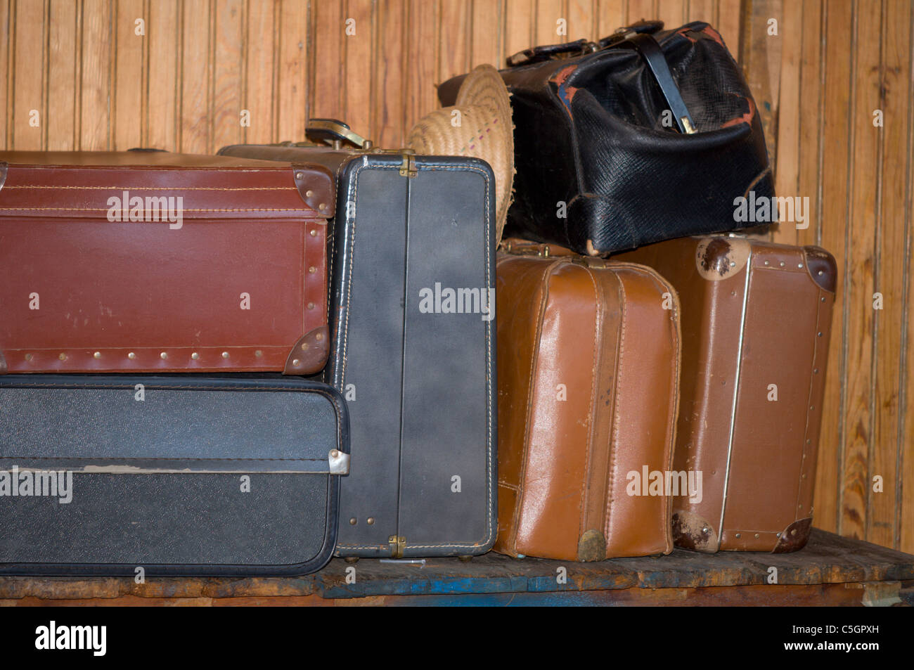 Stack of old luggage at the station Stock Photo - Alamy