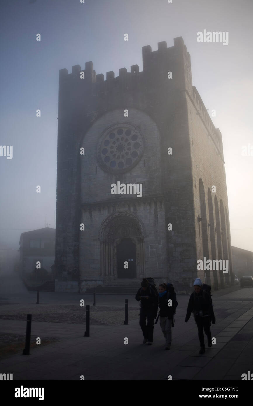 Early morning fog around Portomarin's church, Galicia region, in the ...