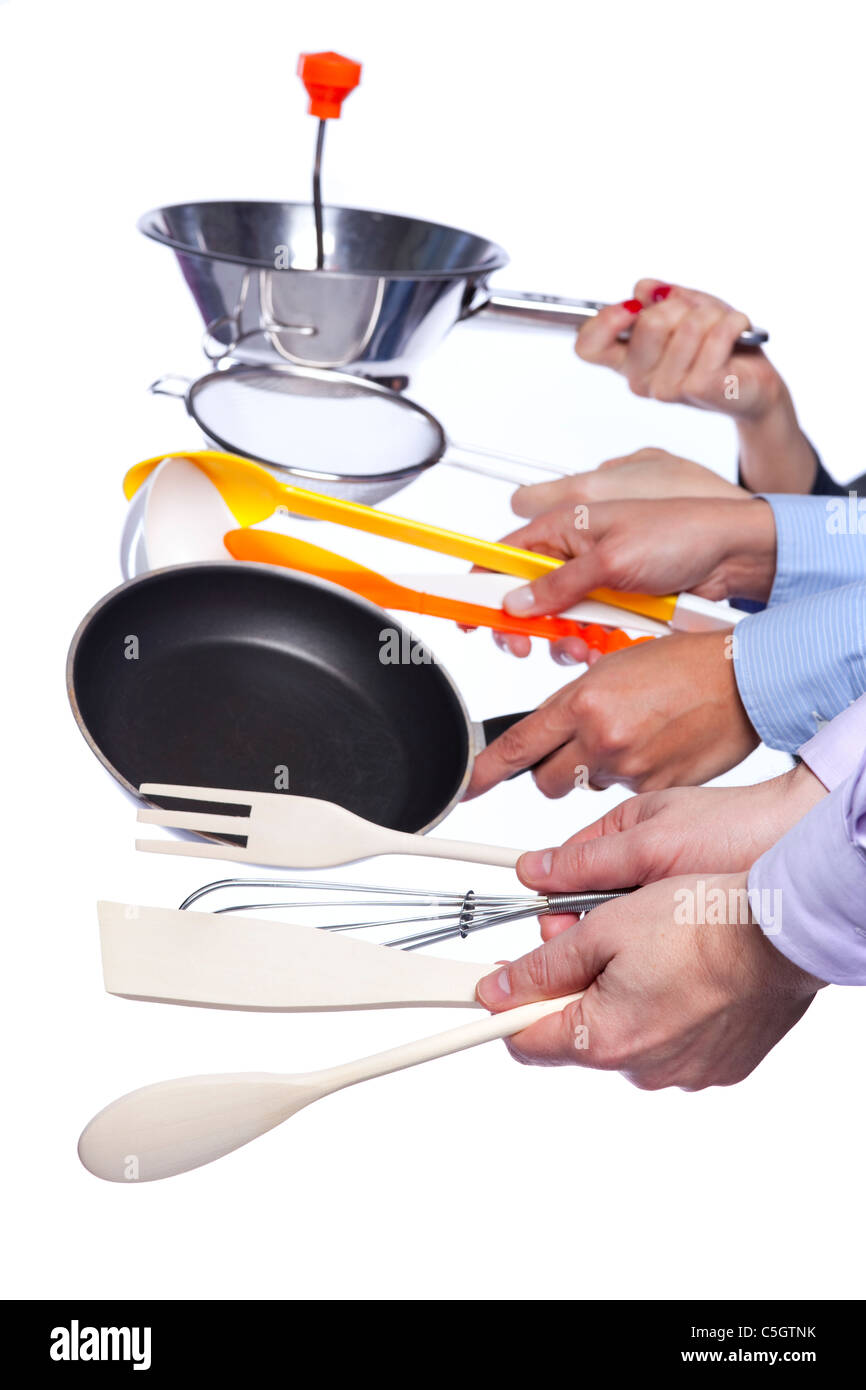 Group of people hands holding some kitchenware tools (selective focus ...