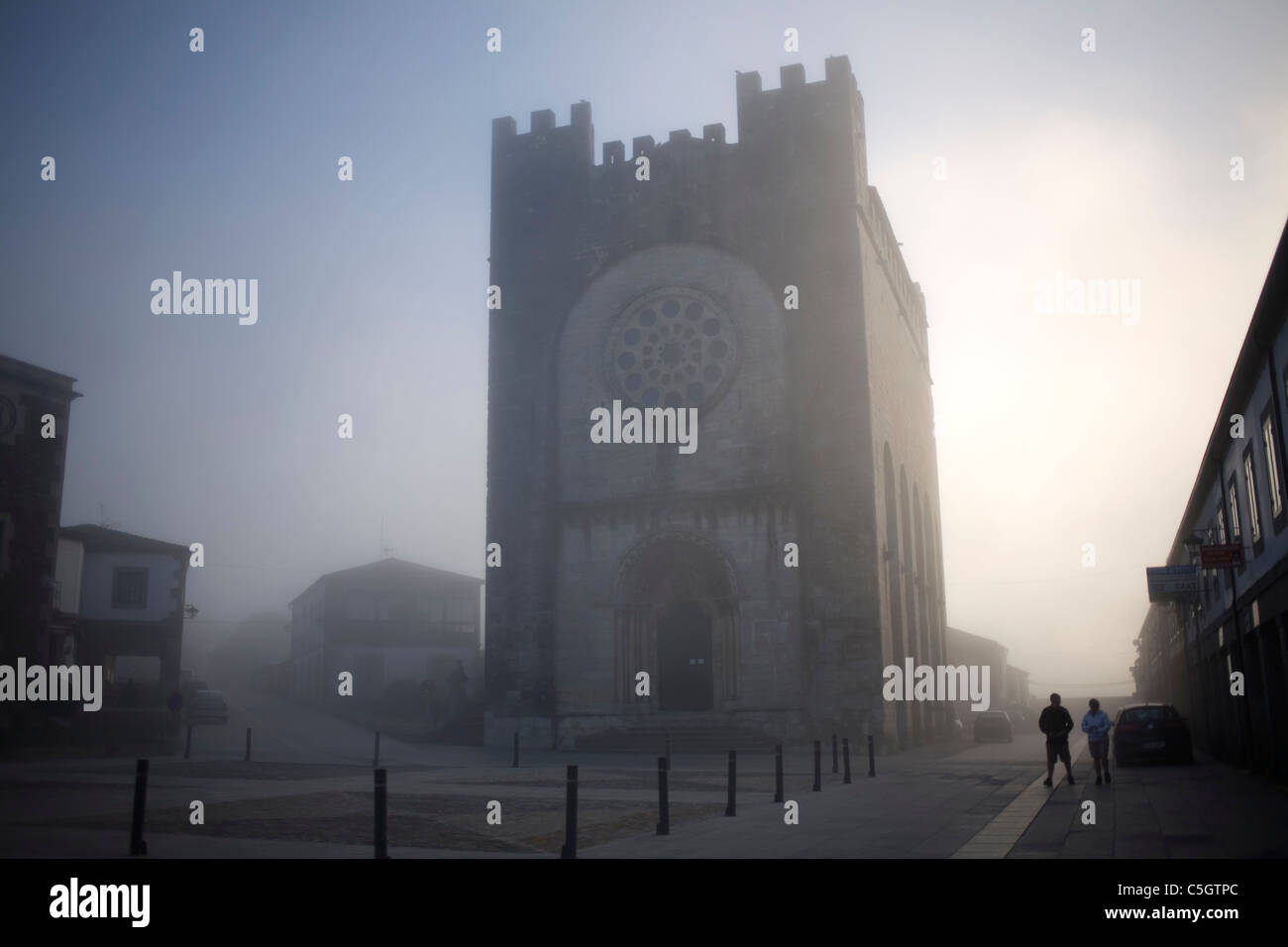 Early morning fog around Portomarin's church, Galicia region, in the ...