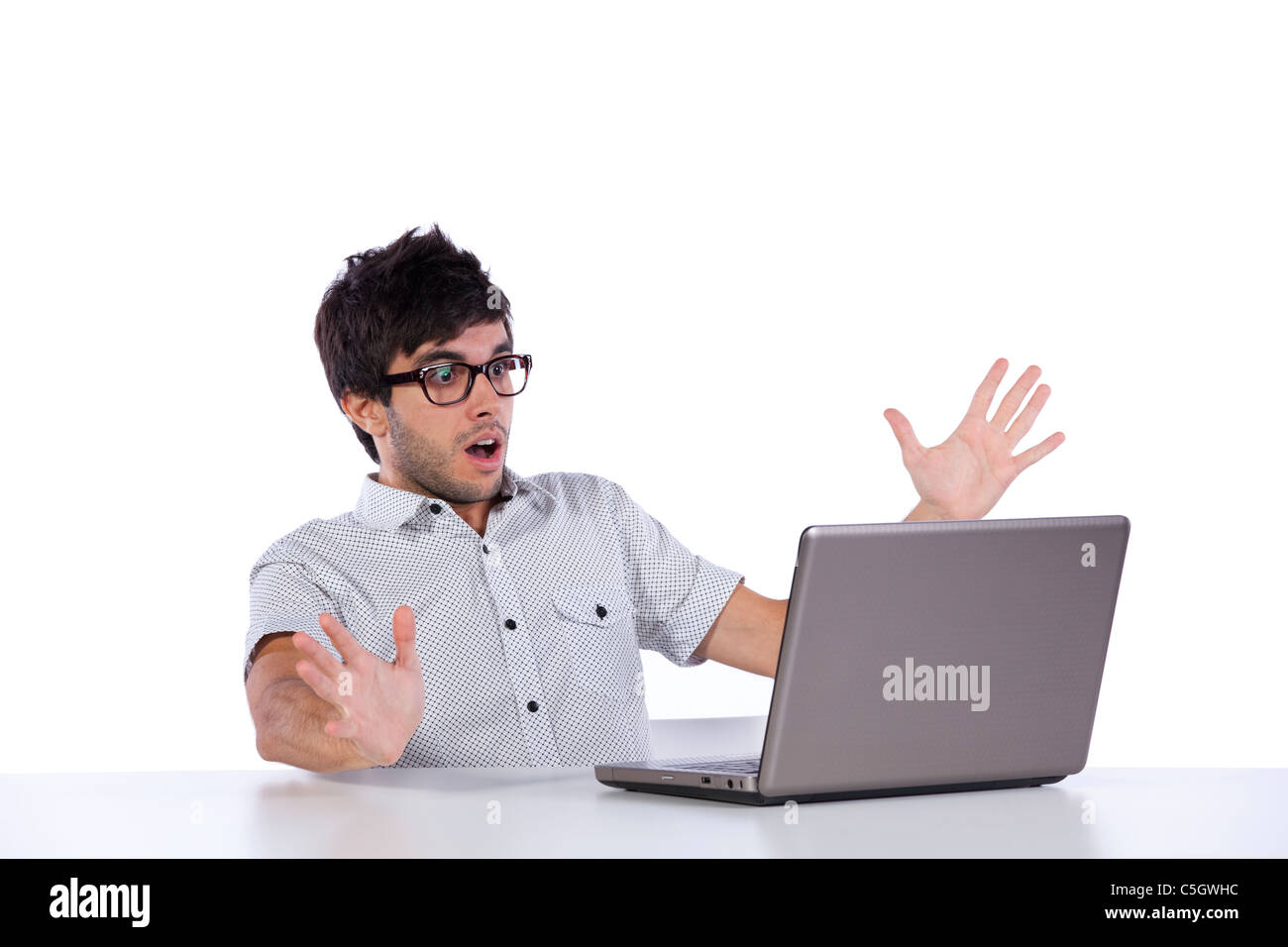 young man scared with something he see on his laptop computer Stock ...