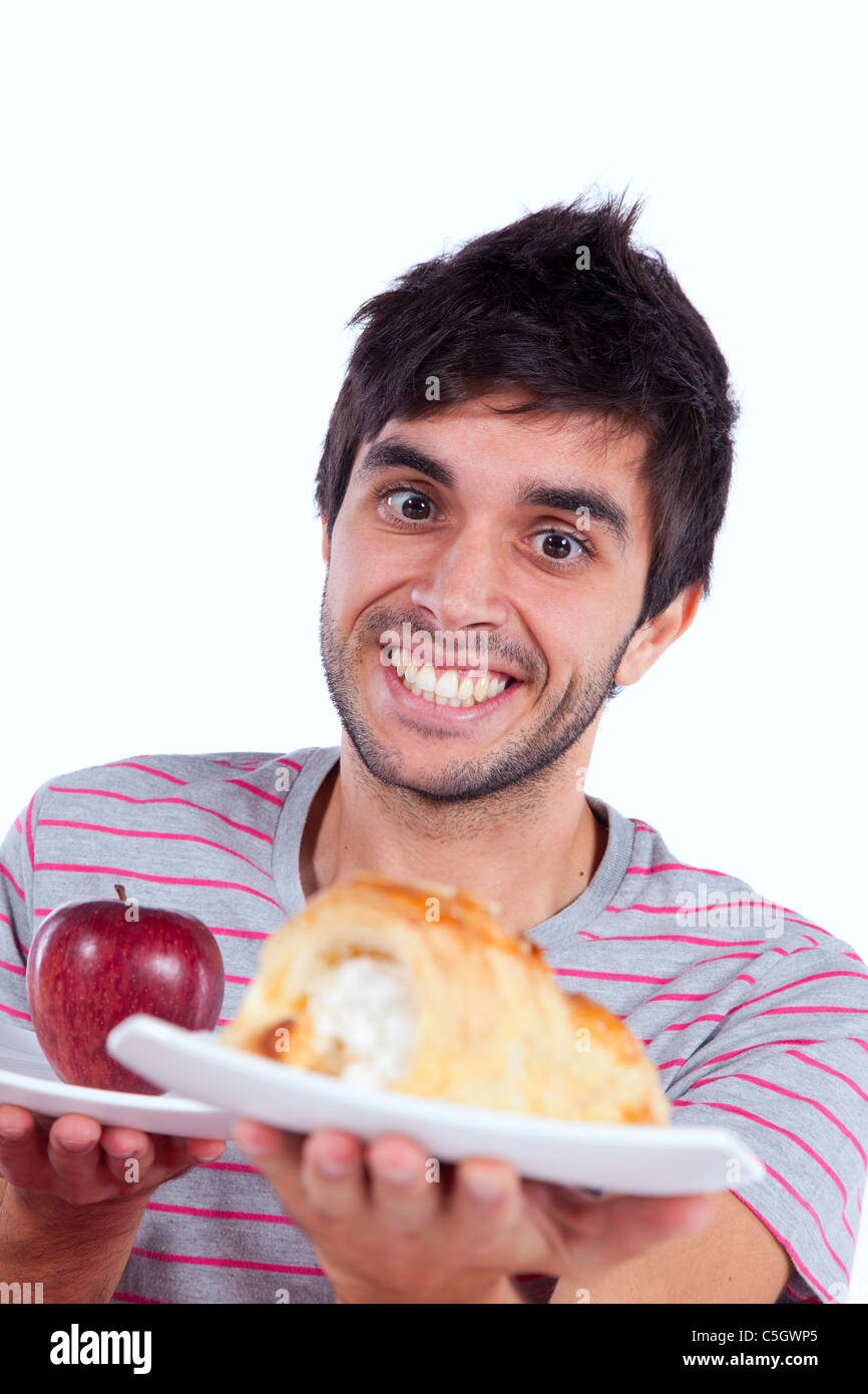 man thinking what to eat between an apple and a cake (isolated on white ...