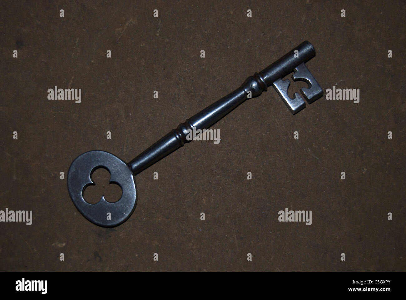 An old, large, church door key, pictured on a stone background Stock ...