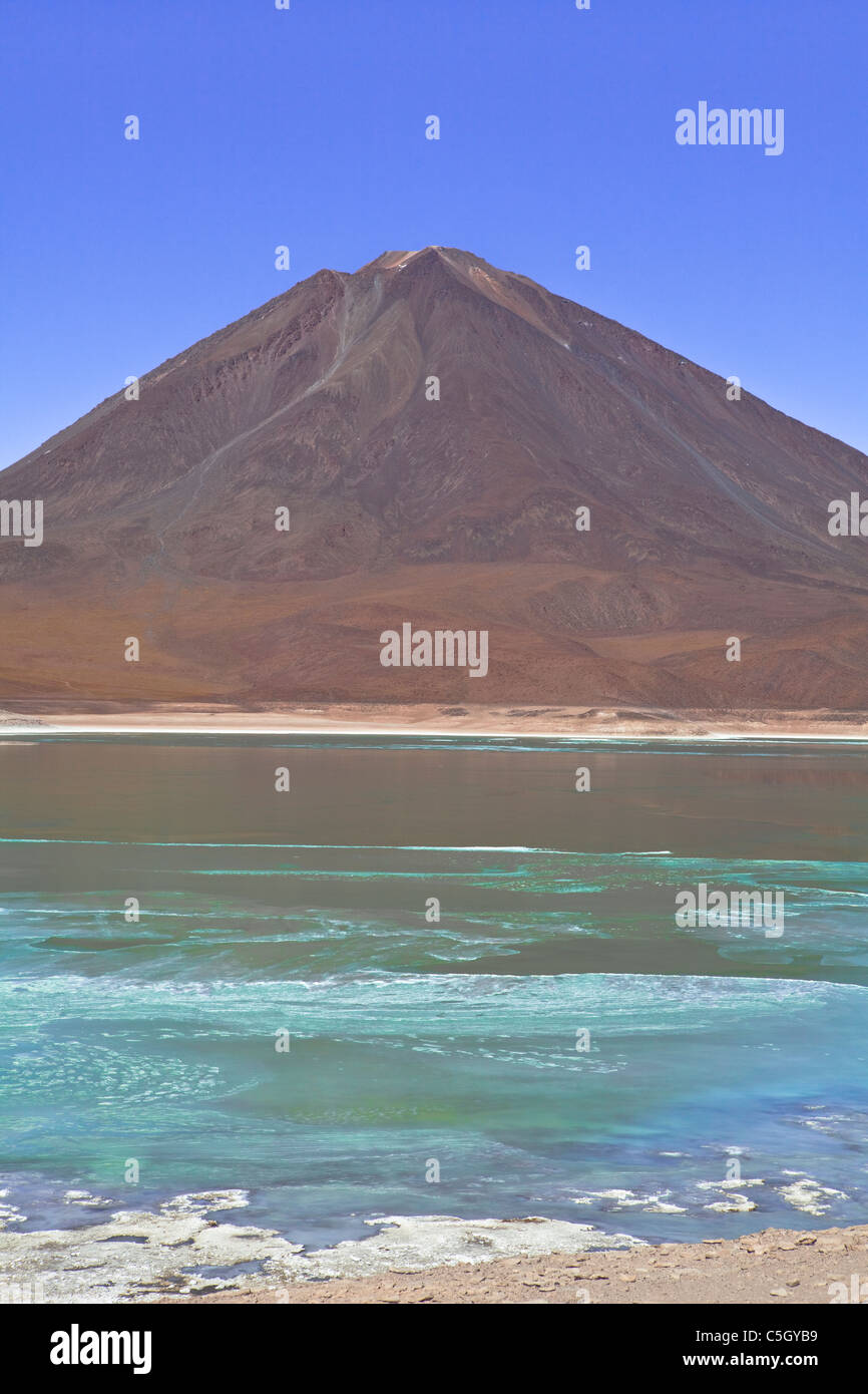 Licancabur Volcano reflected in the green lake Laguna verde, Atacama ...