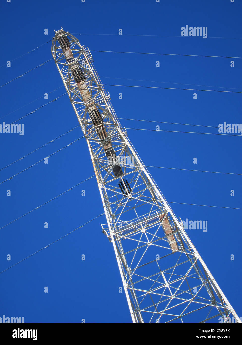 Electrical tower against a blue sky Stock Photo - Alamy