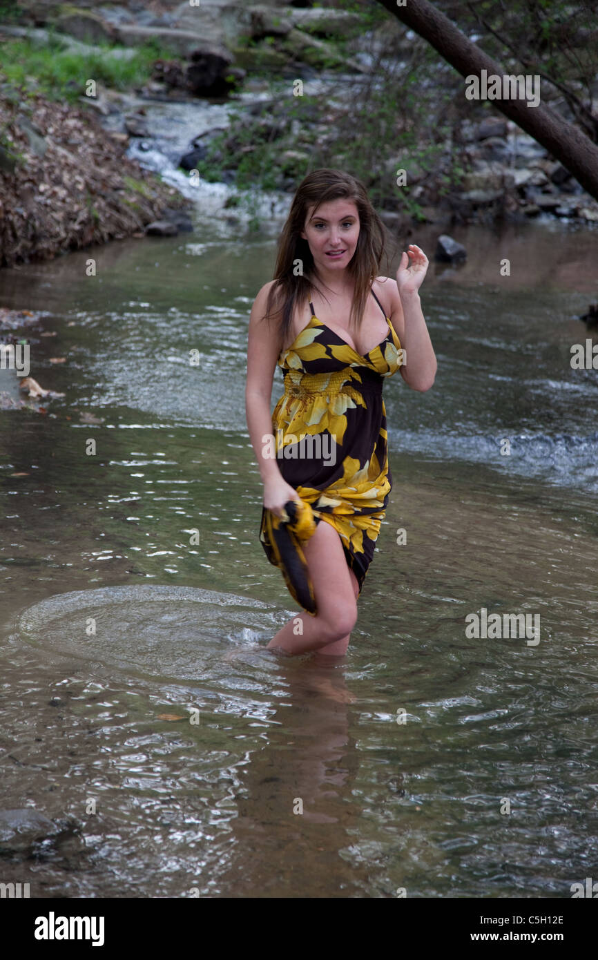 Woman wading in water in a dress hi-res stock photography and images ...