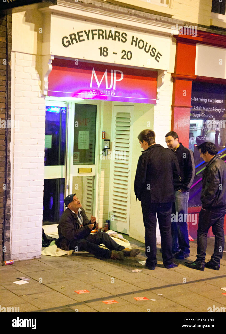 Homeless people in a doorway hi-res stock photography and images - Alamy