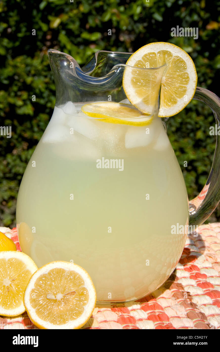 Nice plain pitcher of lemonade sits outdoors at a picnic waiting for ...