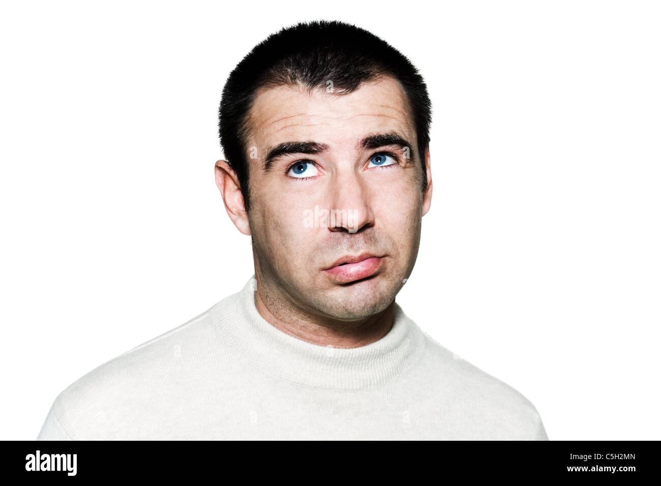 Portrait of an expressive bored man in studio on white isolated ...