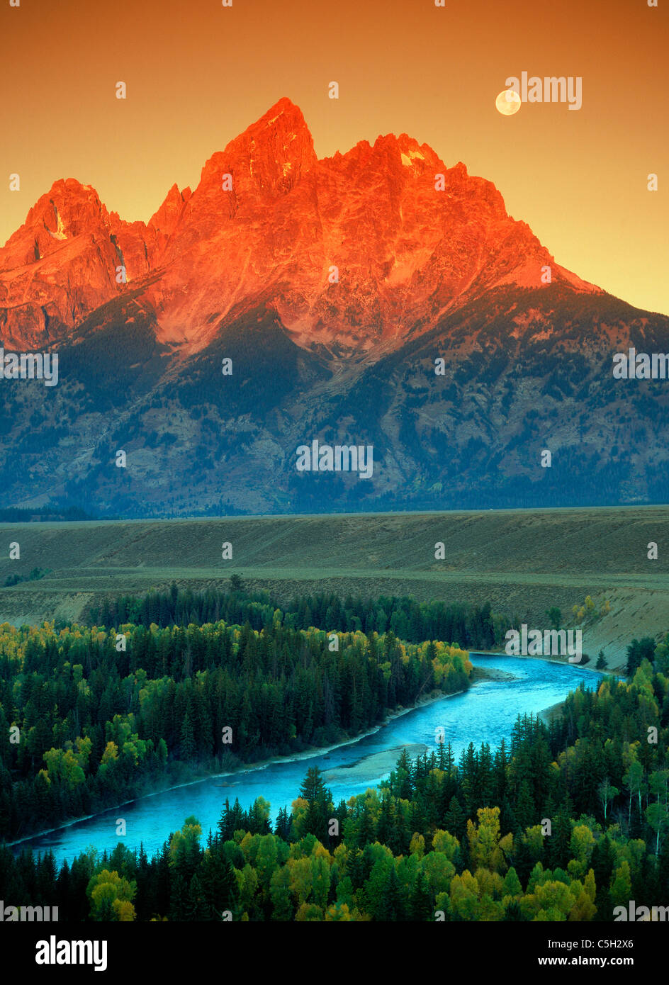 Oxbow bend on Snake River with Grand Tetons under full moon at sunrise ...