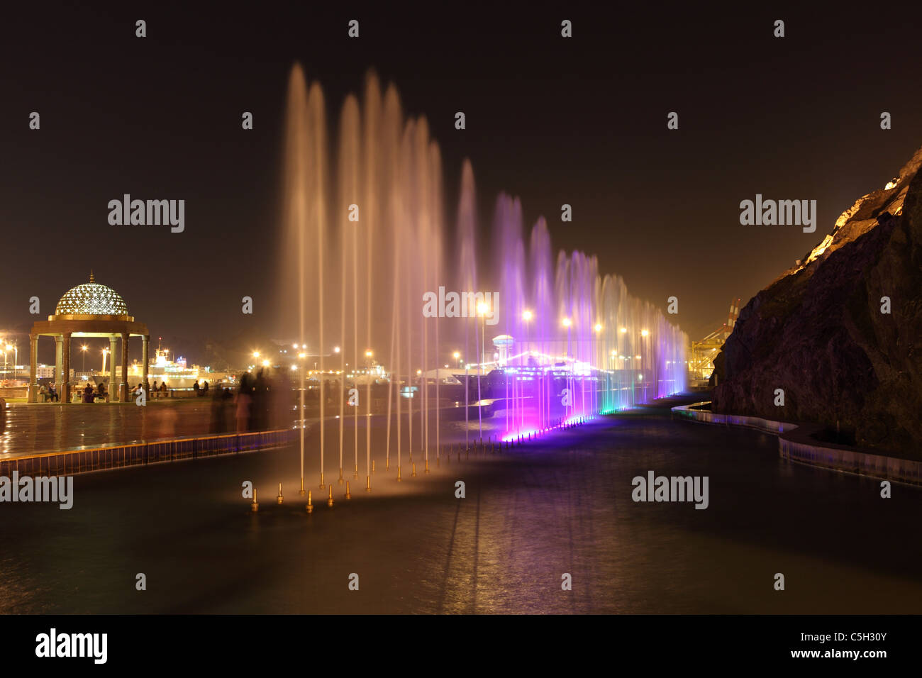 Fountains illumninated at night. Muscat, Sultanate of Oman Stock Photo ...