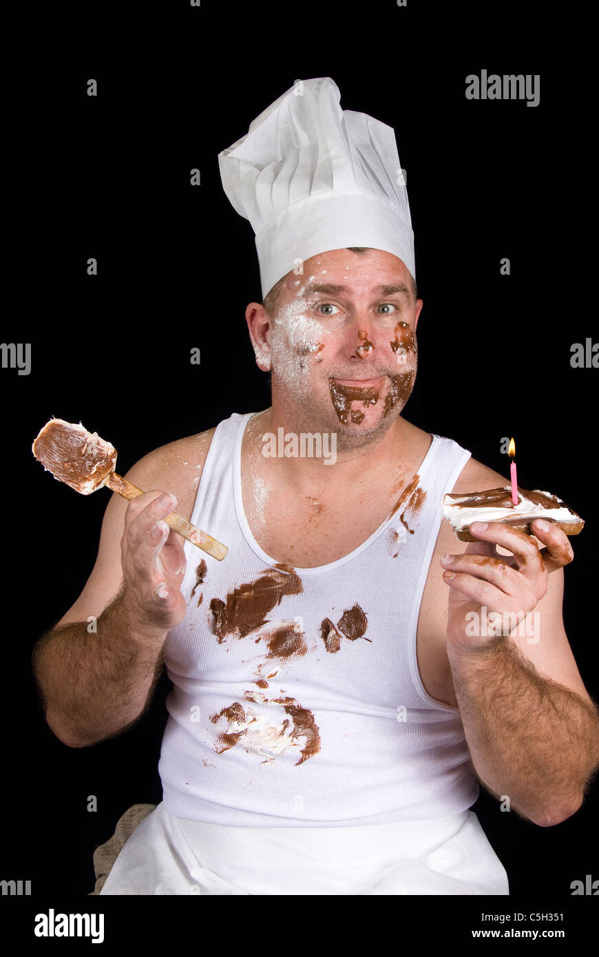 A chef examines his gourmet birthday creation consisting of burnt toast ...