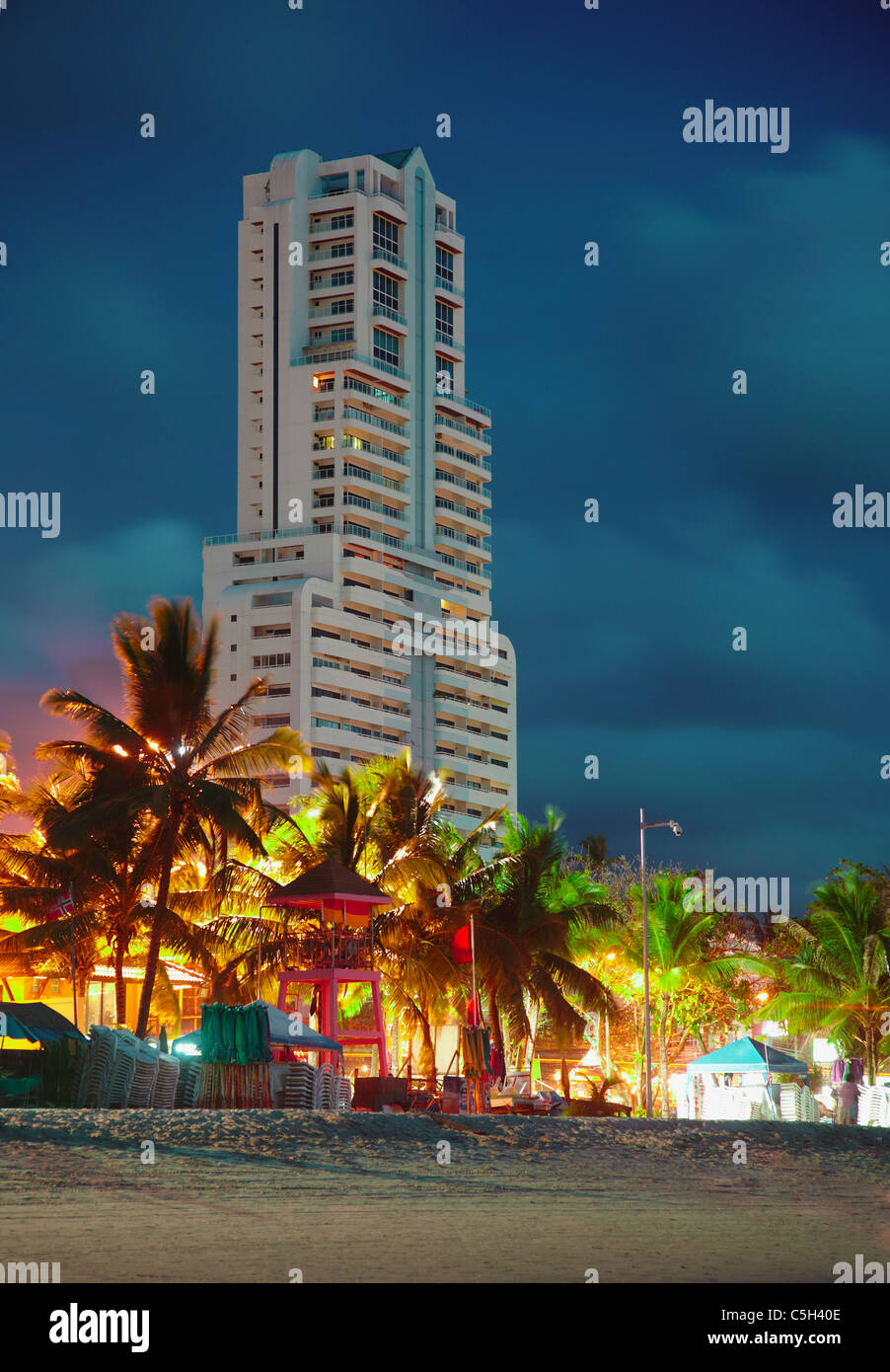 High-rise hotel on the tropical coast of southern sea Stock Photo - Alamy